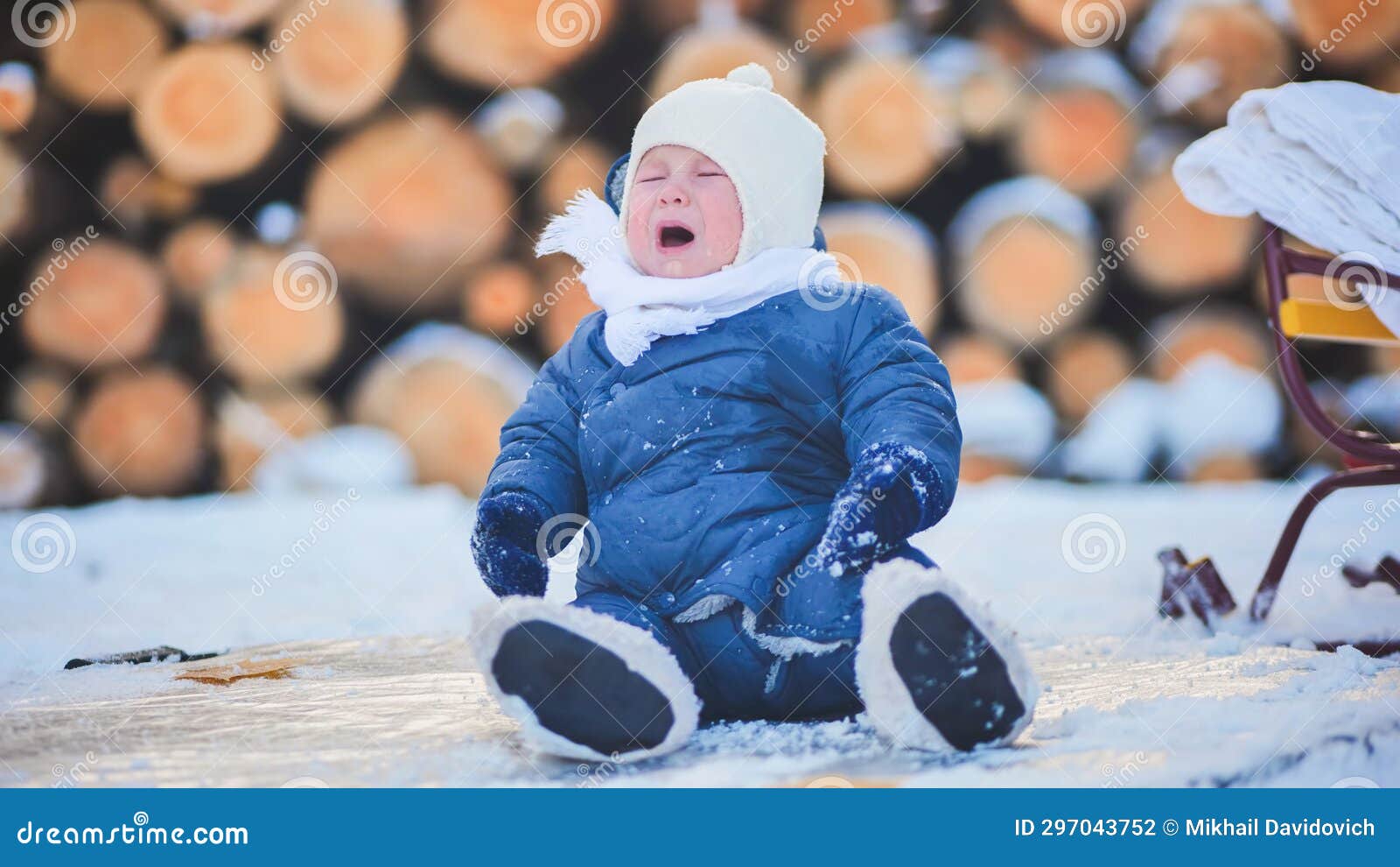 A Little Baby is Crying Sitting in the Snow. Stock Photo - Image of ...