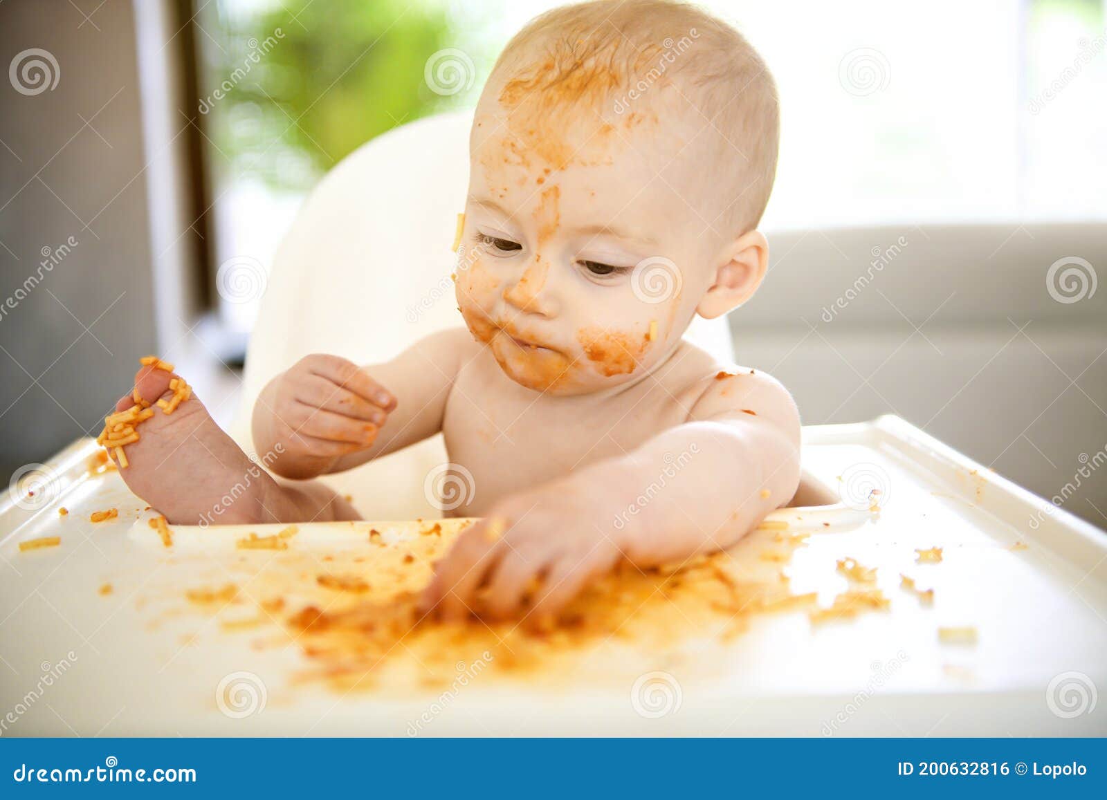 A Little Baby Eating Her Dinner and Making a Mess Stock Photo - Image ...
