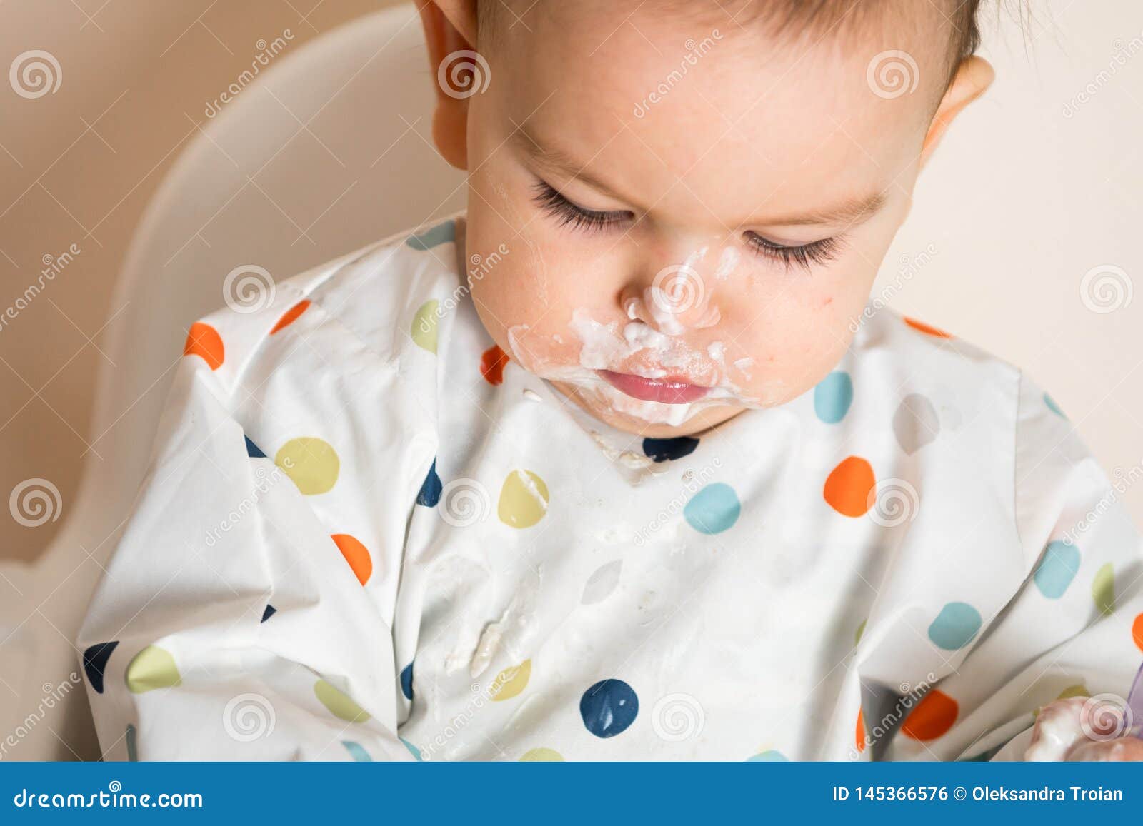 A Little Baby Eating Her Dinner and Making a Mess Stock Photo - Image ...