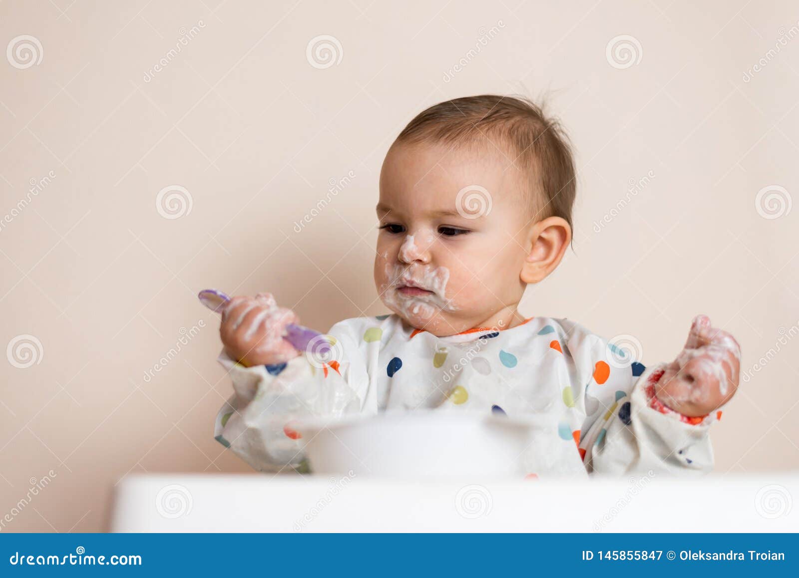 A Little Baby Eating Her Dinner and Making a Mess Stock Image - Image ...