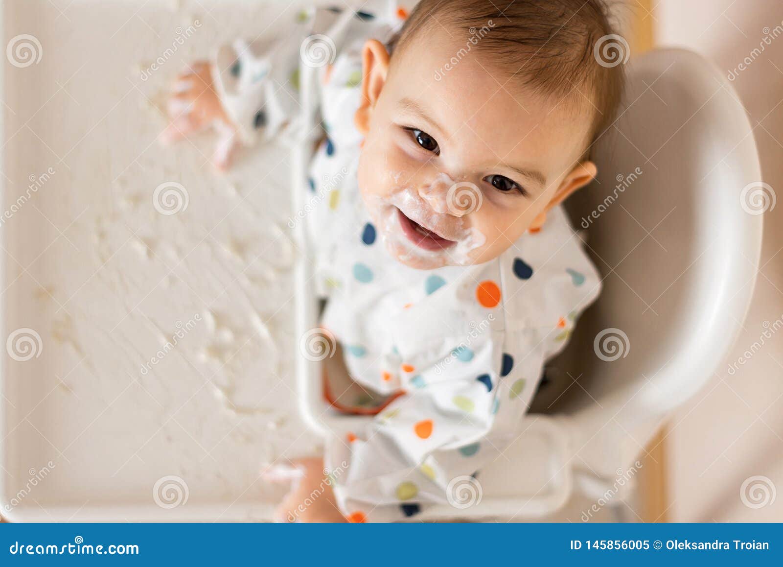 A Little Baby Eating Her Dinner and Making a Mess Stock Image - Image ...