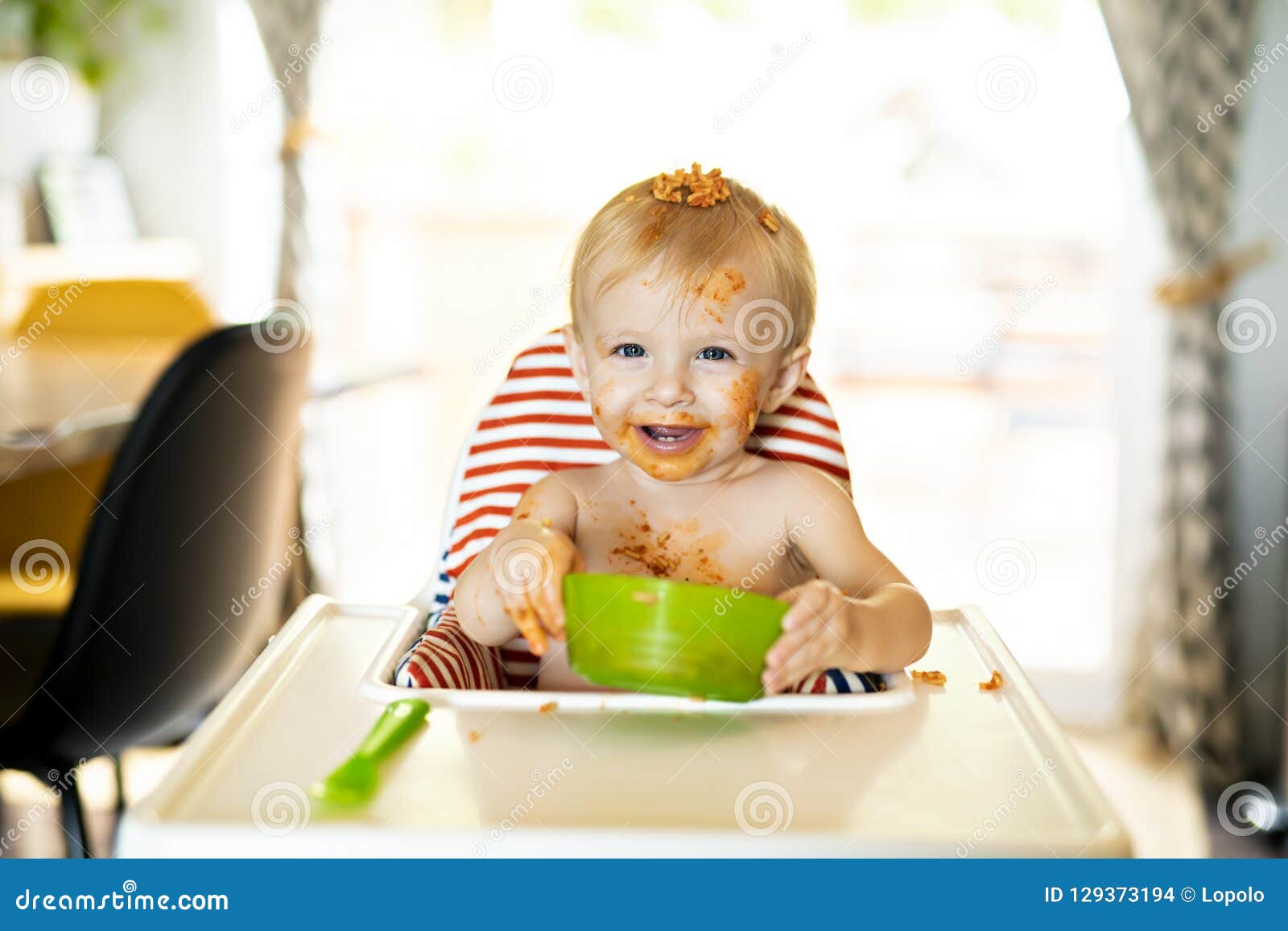 Little Baby Eating Spaghetti Dinner and Making a Mess Stock Photo ...