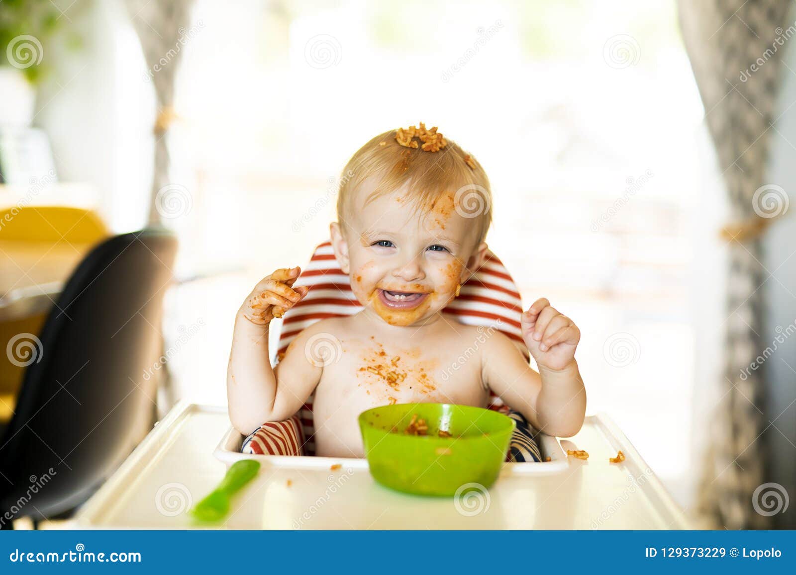 Little Baby Eating Spaghetti Dinner and Making a Mess Stock Image ...