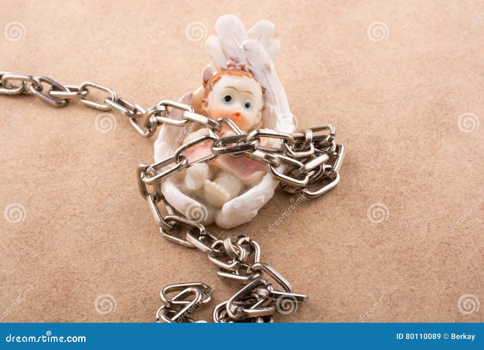 Little Baby Figure in a Cradle in Chains Stock Image - Image of object ...