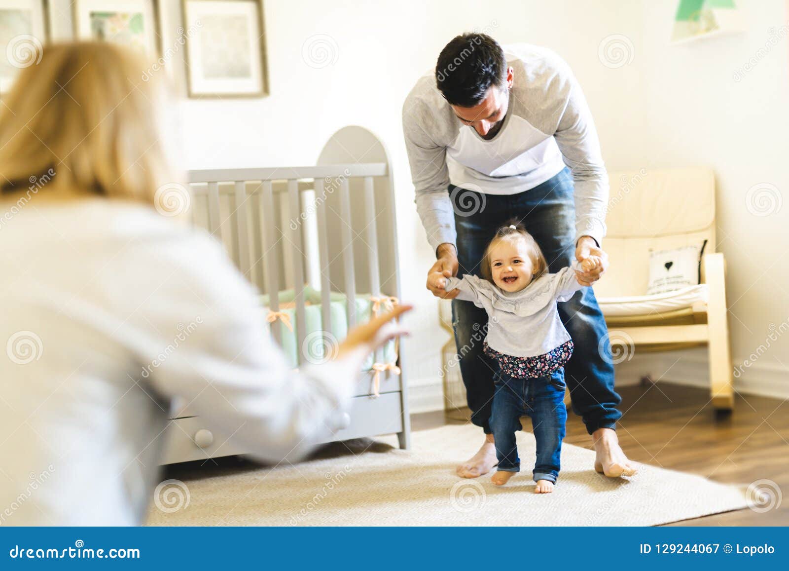 Little Baby Girl First Steps with the Help of Parent Stock Image ...