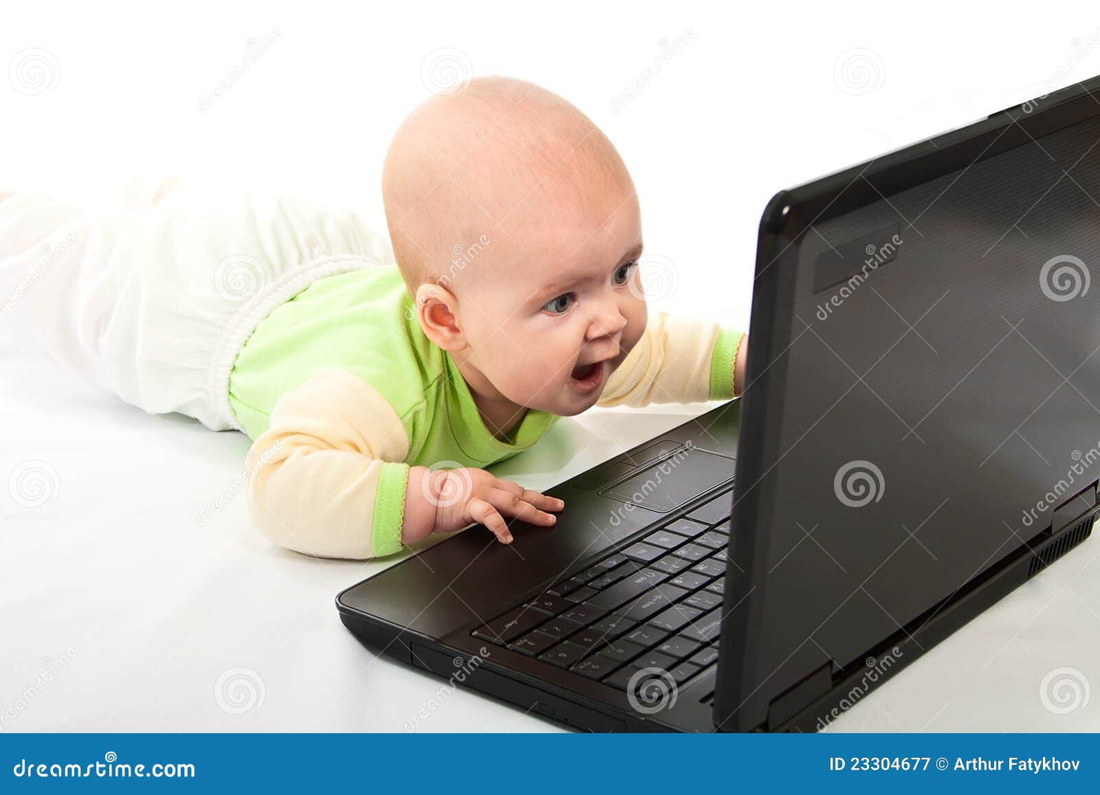 Little Baby With Laptop. Royalty Free Stock Photography - Image: 23304677