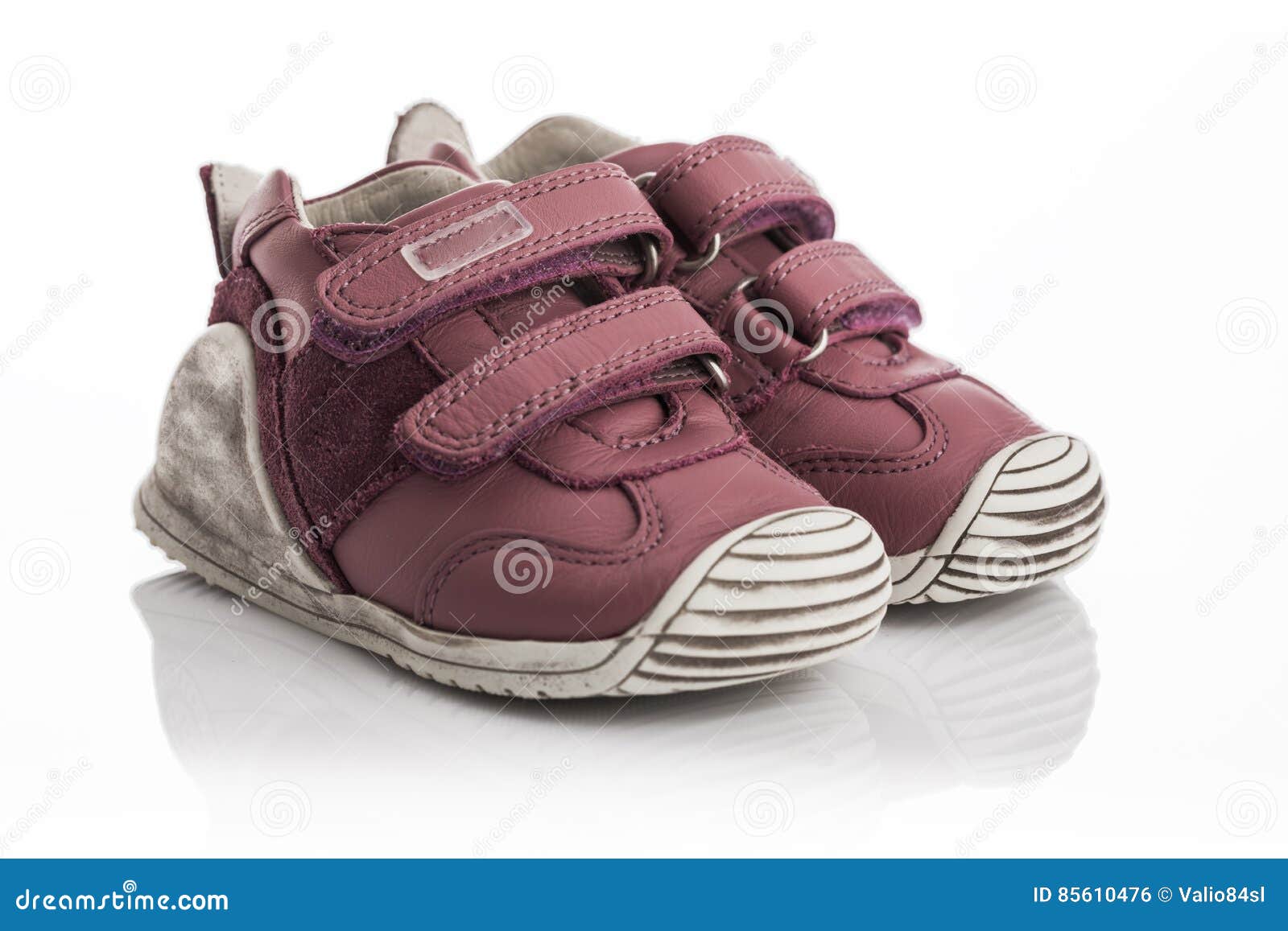 Little baby shoes on white stock photo. Image of color - 85610476