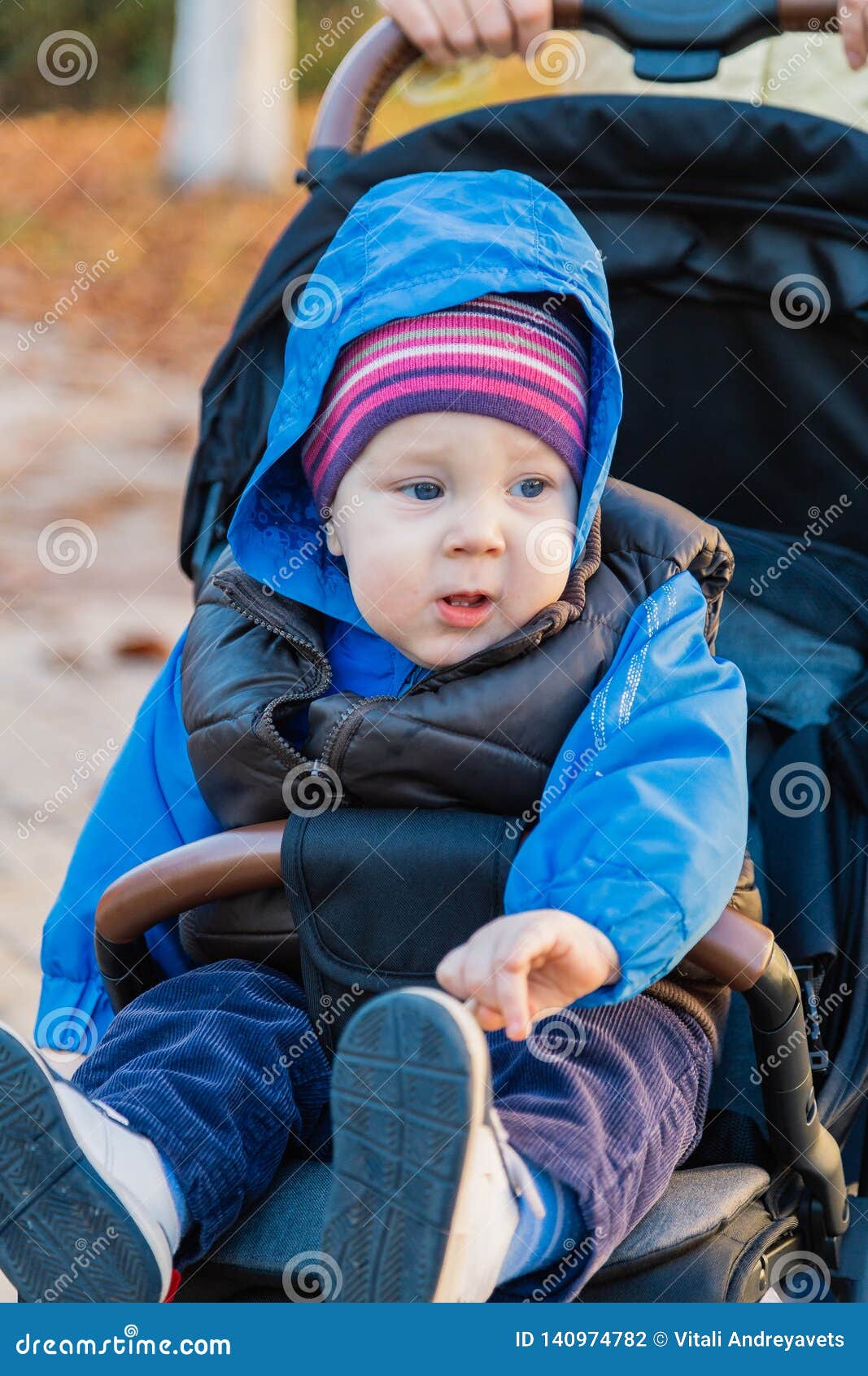 The Little Baby is Sitting in the Pram. Stock Photo - Image of girl ...