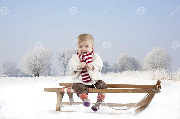 Little baby on a sledge stock image. Image of snow, play - 28832261