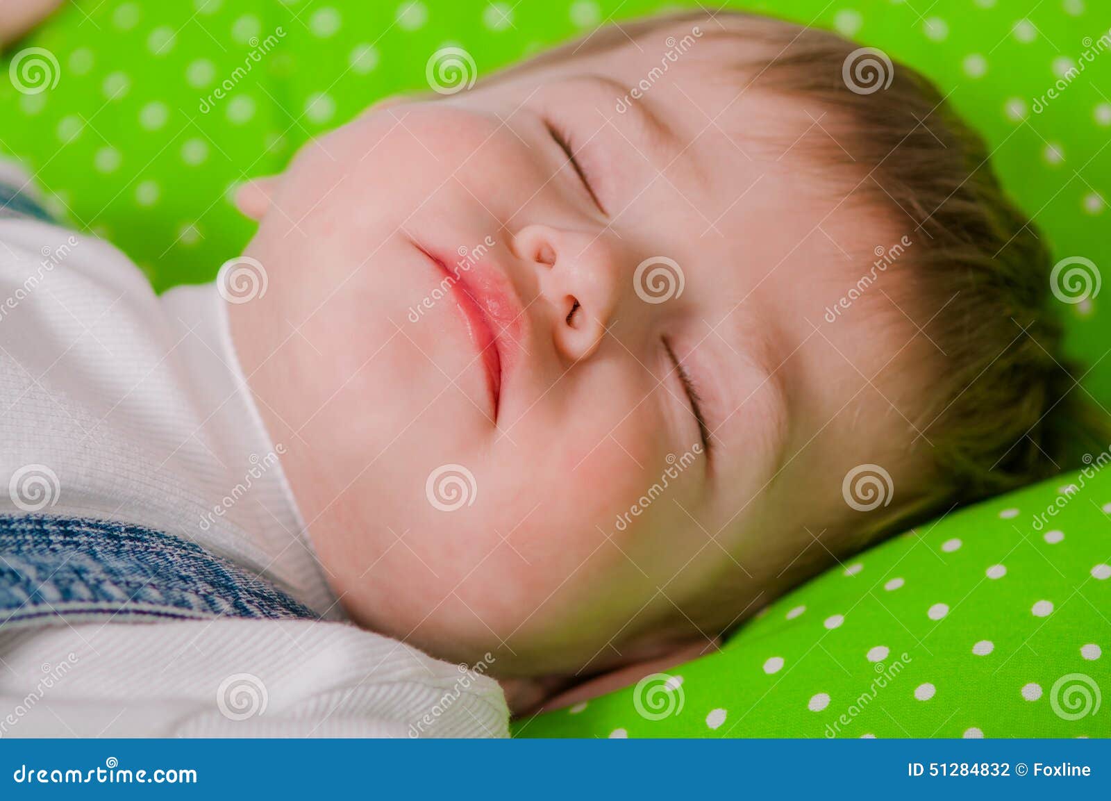Little Baby Sleeping on Green Cushion Stock Photo - Image of closed ...