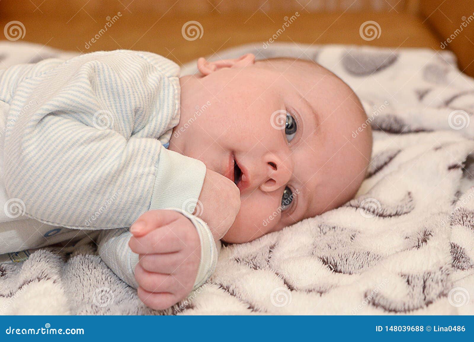 Little Beautiful Baby is Thinking Stock Photo - Image of lying ...