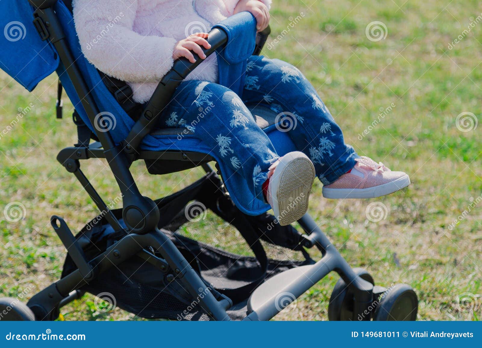 Little Beautiful Girl Sitting in the Stroller. Stock Image - Image of ...