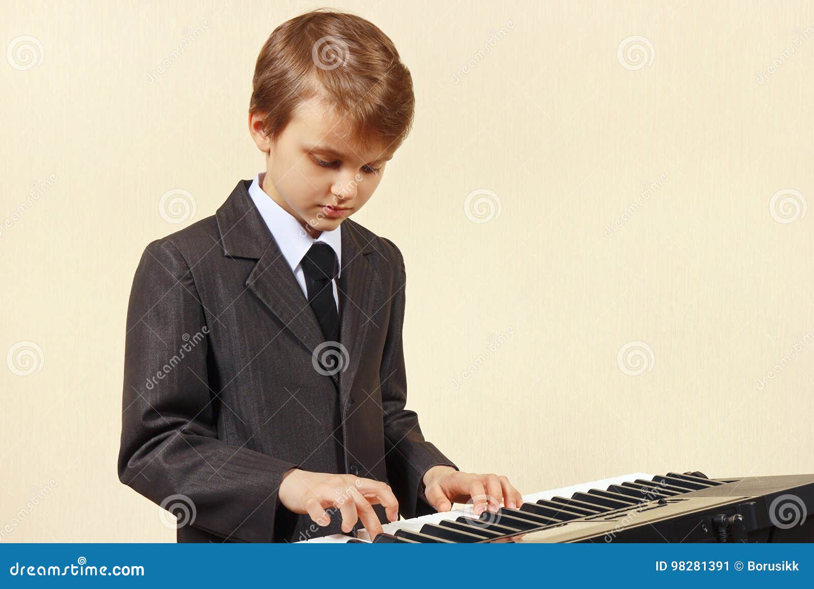 Little Beginner Musician in Suit Playing the Synthesizer Stock Image ...