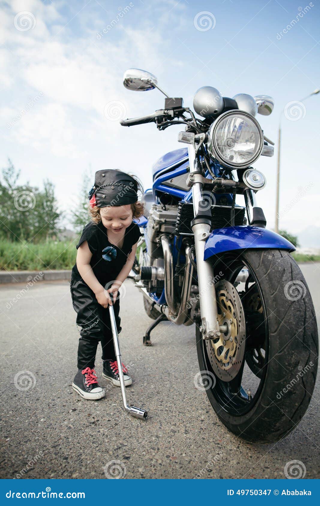 Little Biker Repairs Motorcycle on Road Stock Image - Image of cool ...