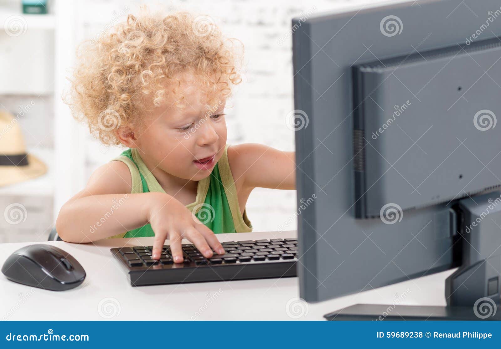 A Little Blond Boy Playing with the Keyboard Stock Photo - Image of ...