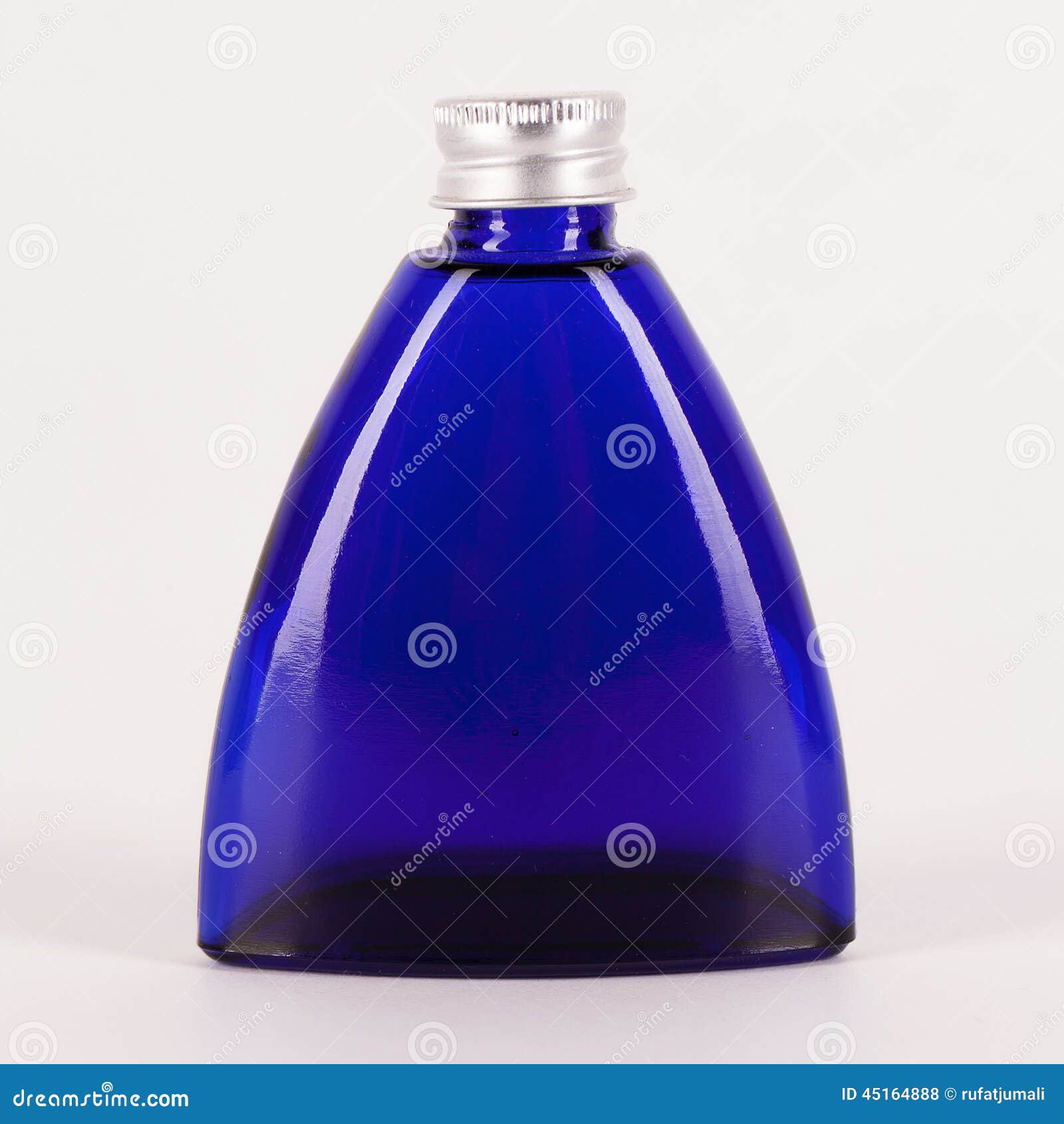 Little Blue Bottle Isolated Stock Photo - Image of mineral, liquid ...