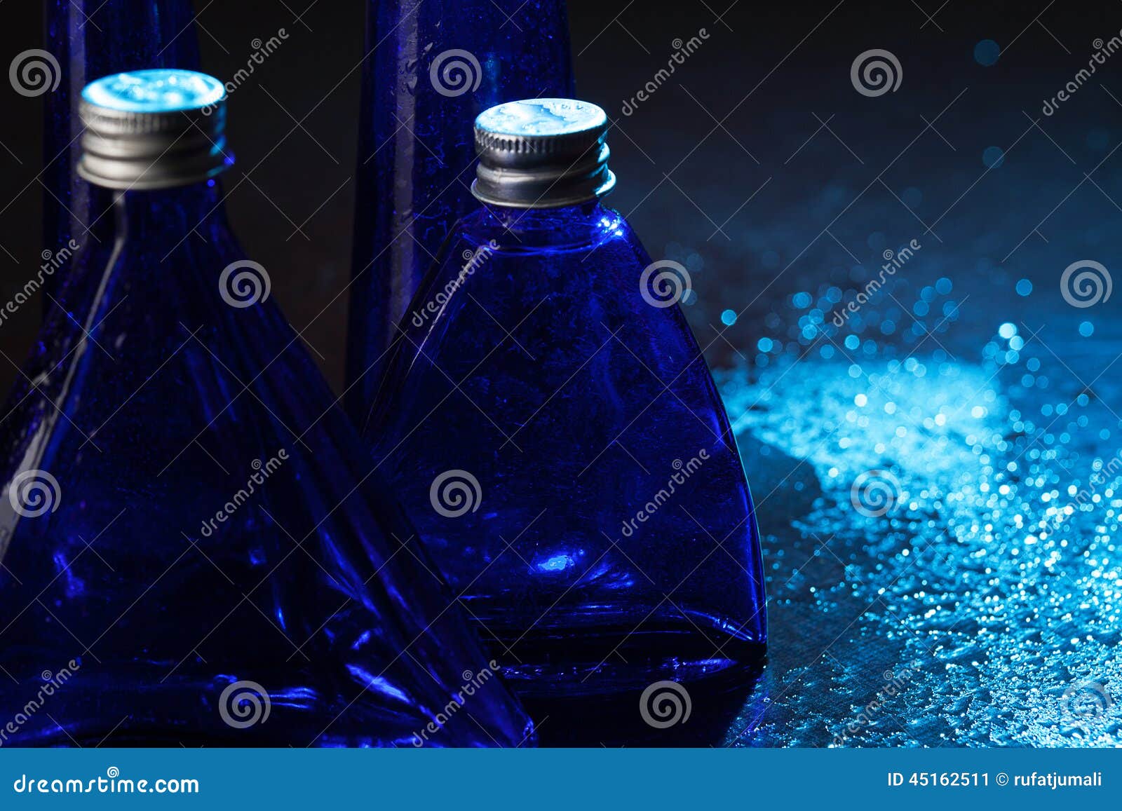 Little Blue Bottles on a Background Stock Image - Image of background ...