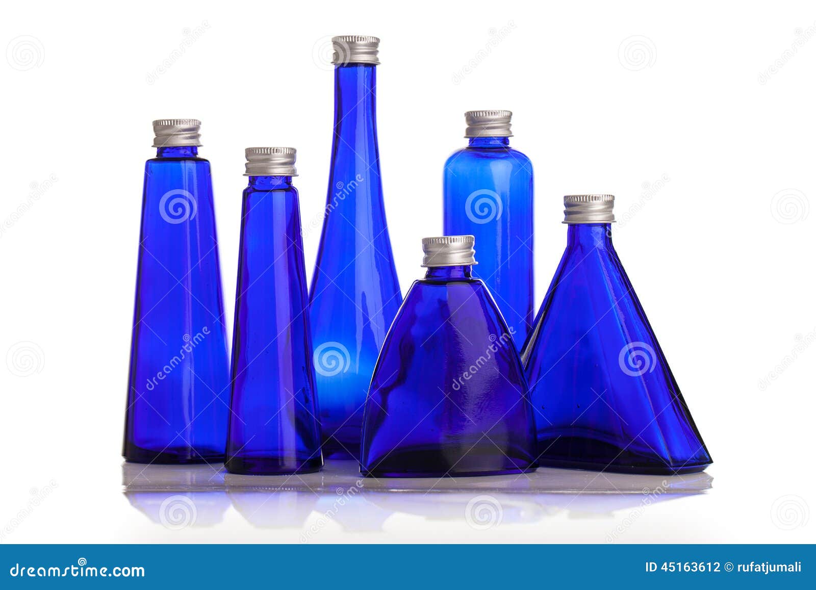 Little Blue Bottles Isolated Stock Photo - Image of beverage, container ...
