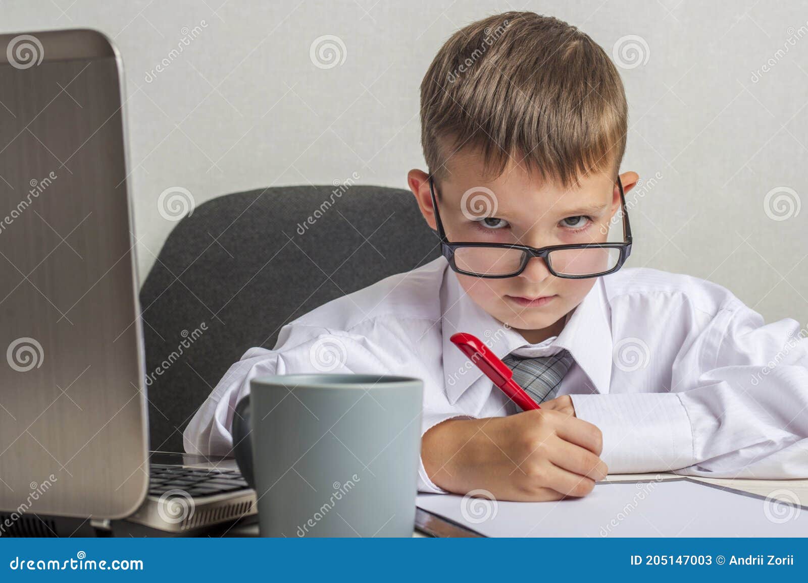 Little Boss in the Office. a Kid Businessman with Glasses Working with ...