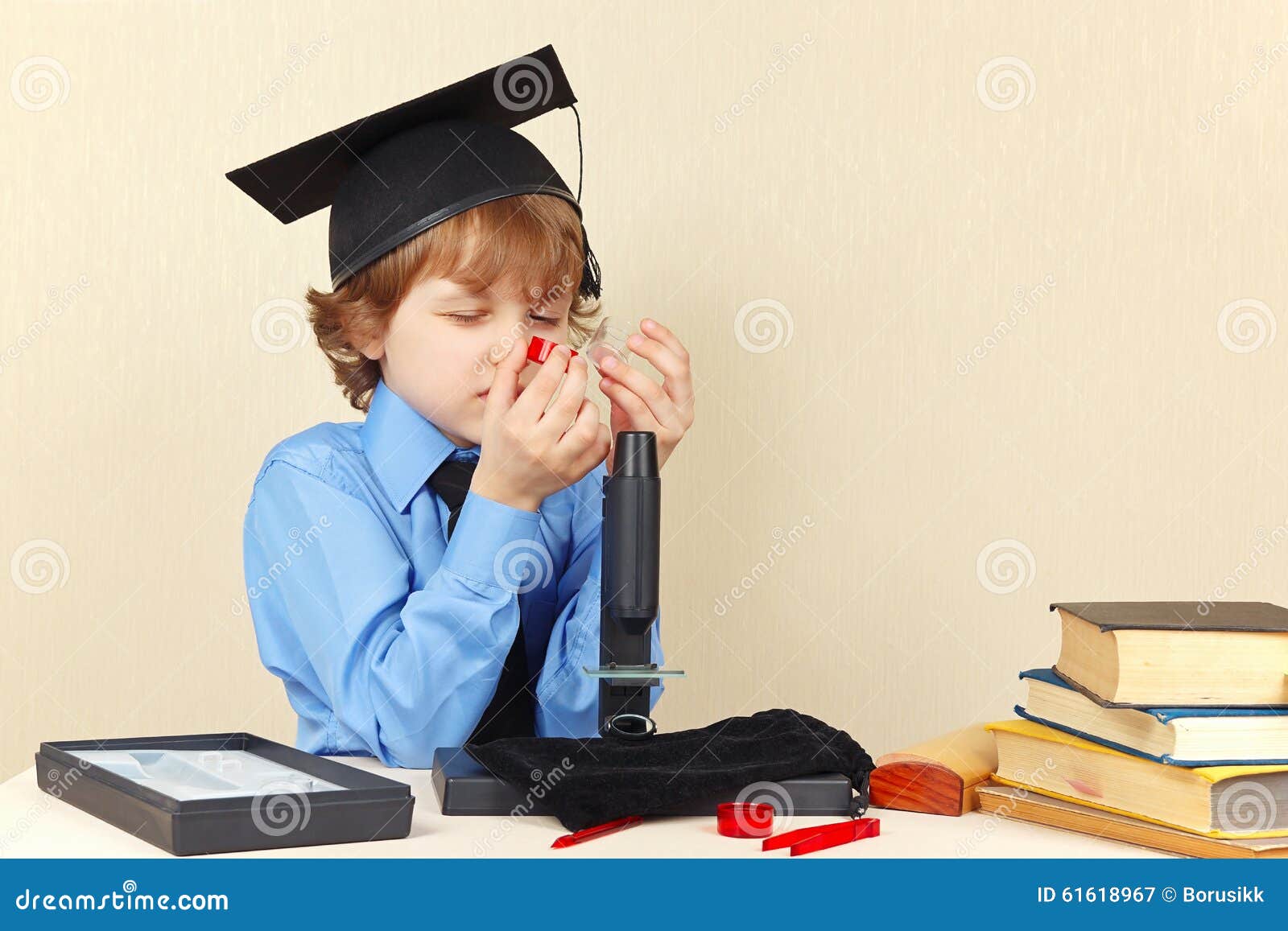 Little Boy in Academic Hat Sees Jars for Research Next To Microscope ...