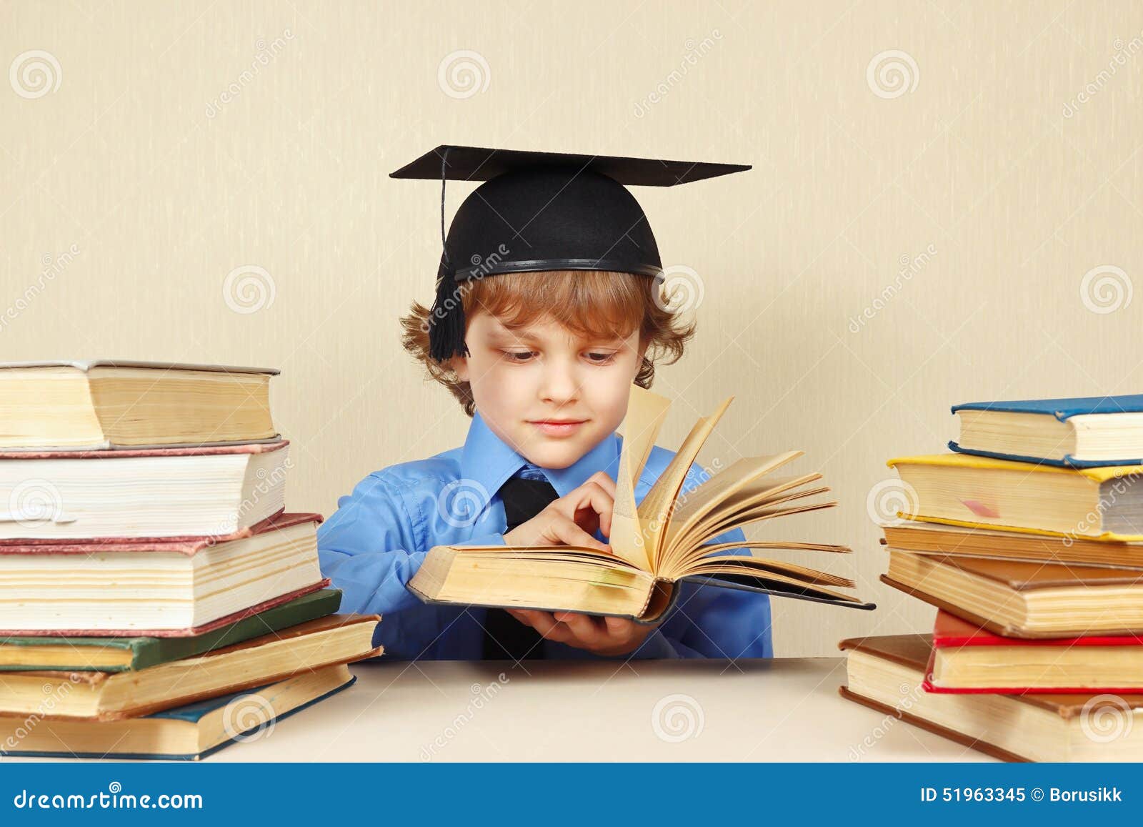 Little Boy in Academic Hat Turns the Pages of Old Book Stock Image ...