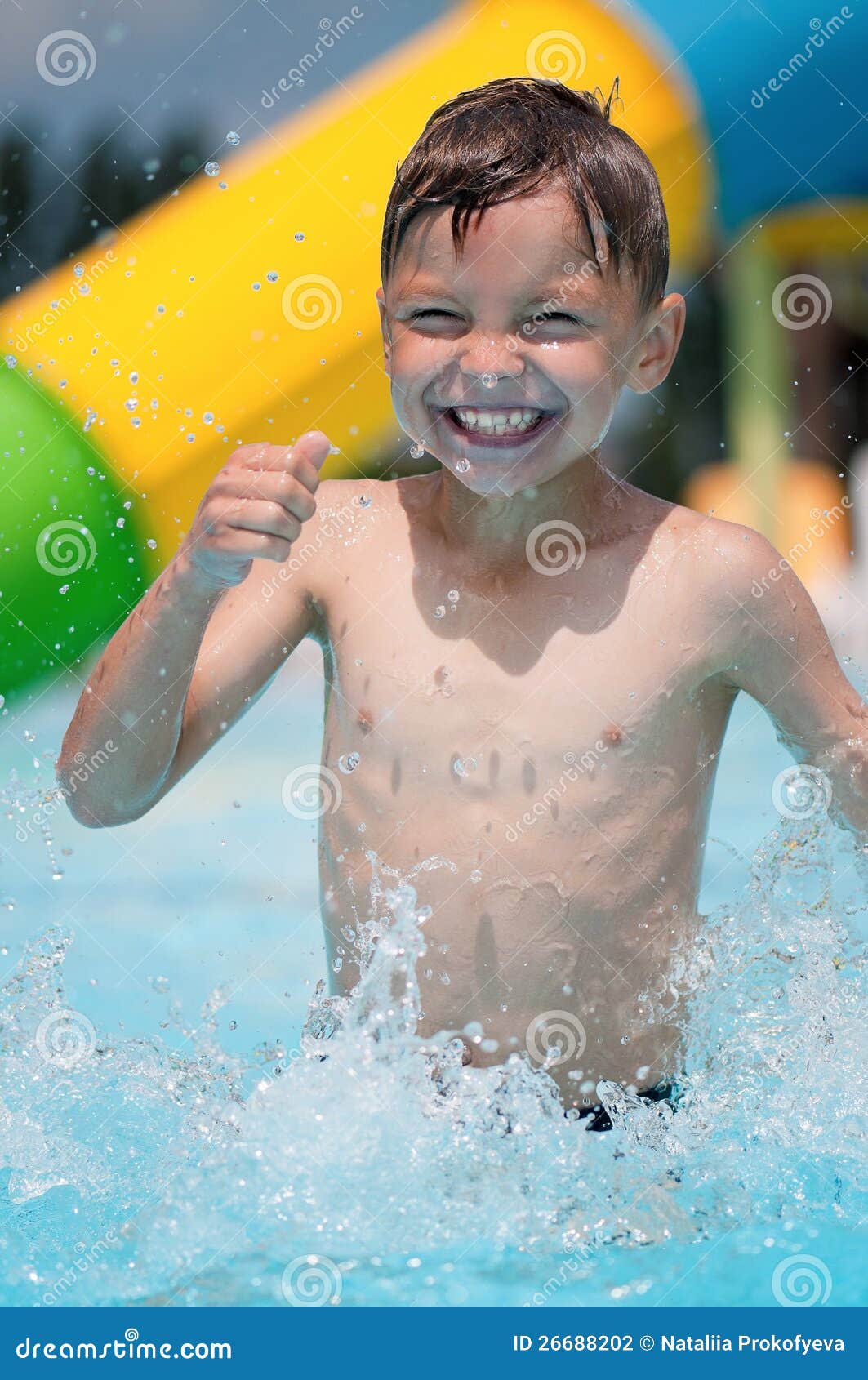 Little boy at aqua park stock photo. Image of background - 26688202