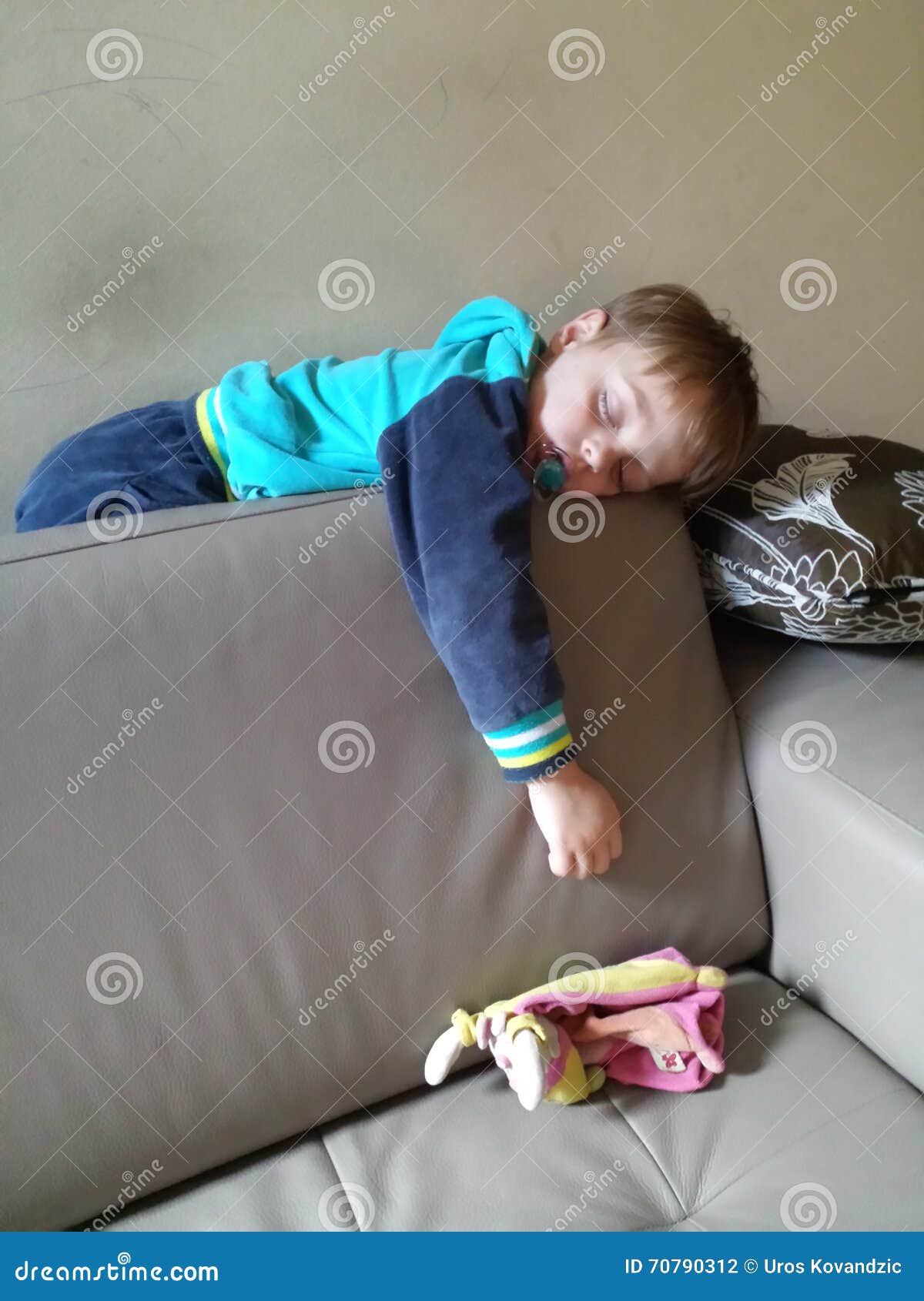 Little boy asleep on couch stock photo. Image of couch - 70790312