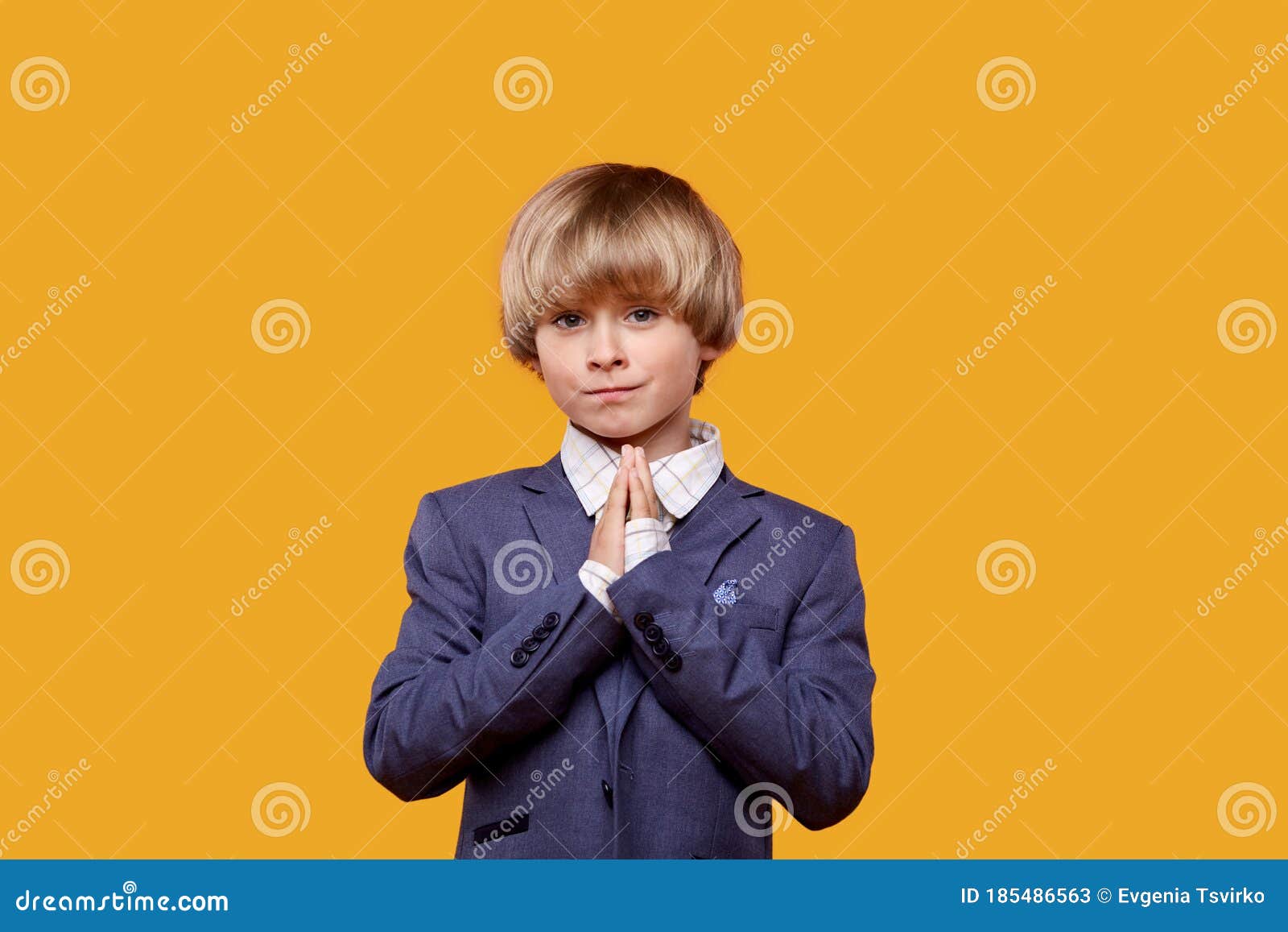 A Little Boy with a Begging Eye Looks into the Camera. Stock Image ...