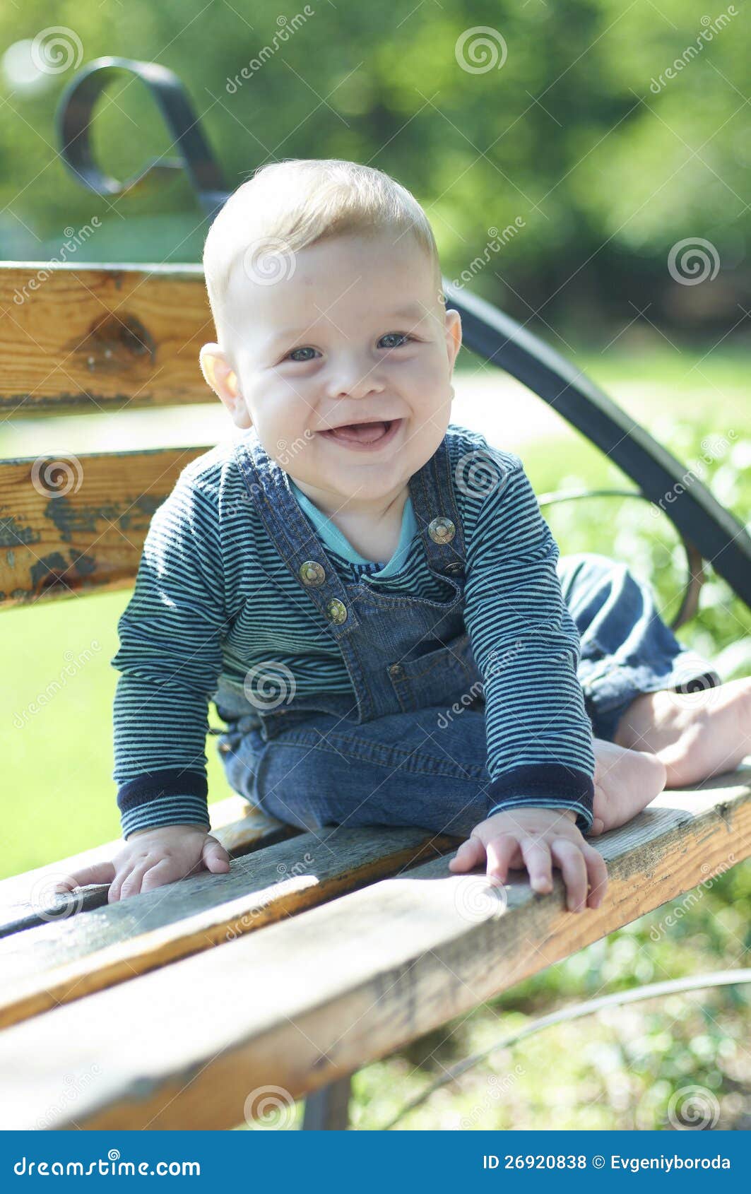 Little boy on a bench stock photo. Image of jeans, beautiful - 26920838