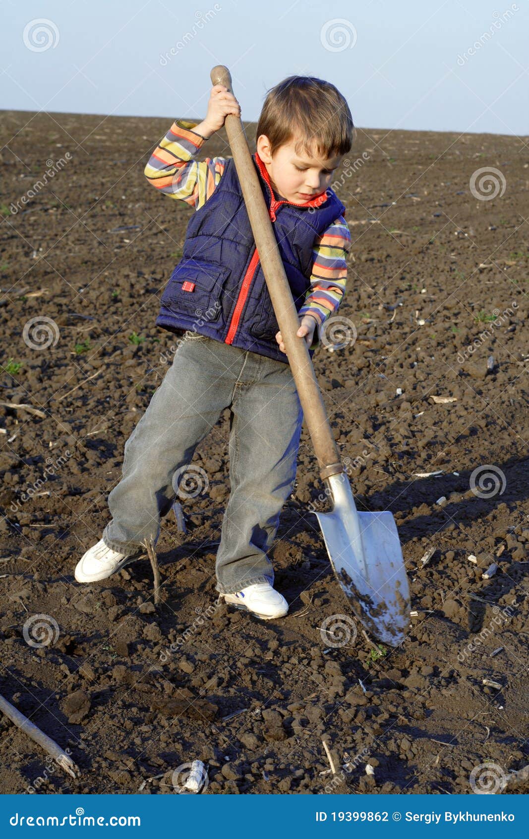 Little boy with big shovel stock photo. Image of cultivate - 19399862