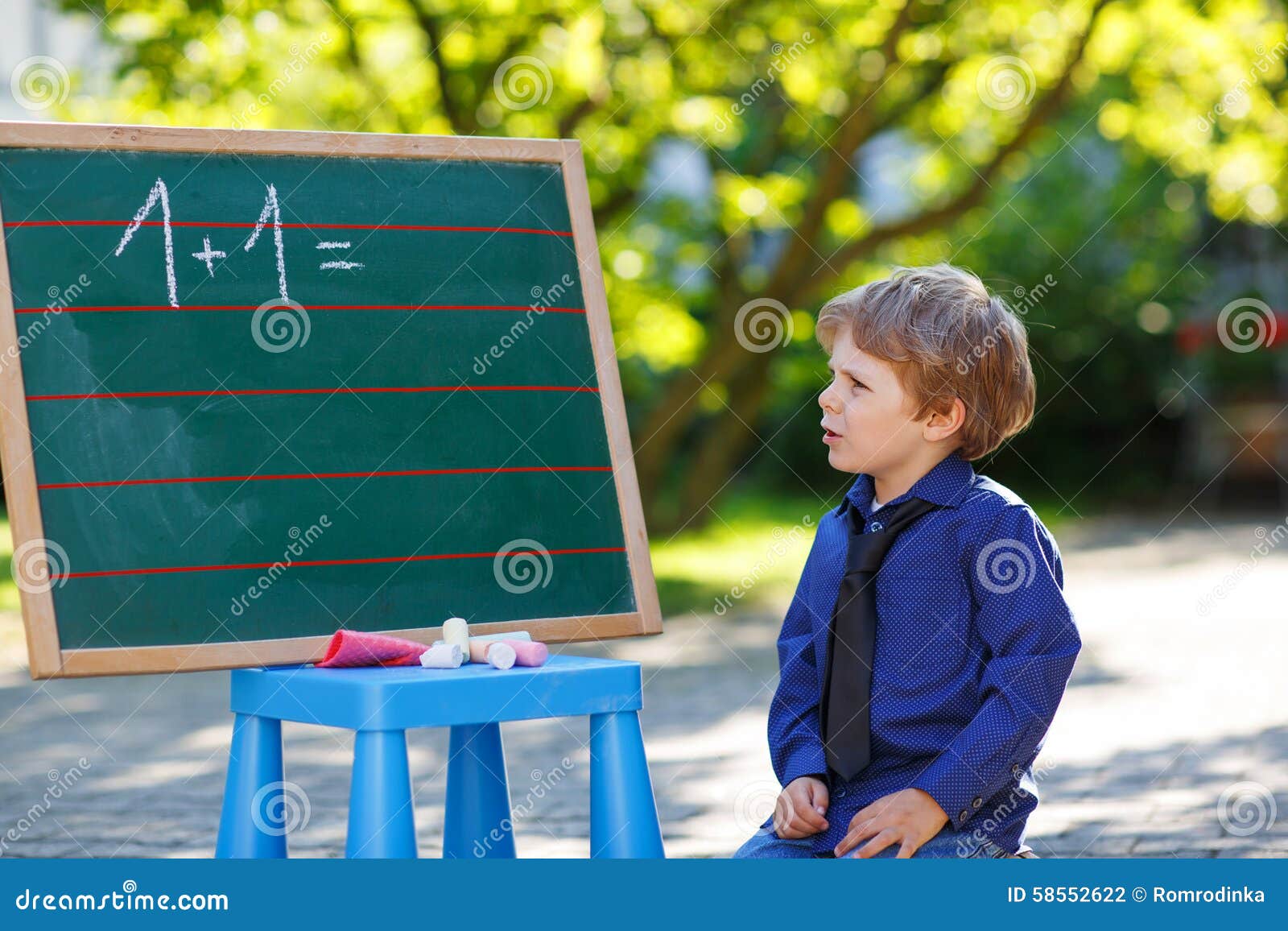 Little Boy at Blackboard Practicing Mathematics Stock Photo - Image of ...
