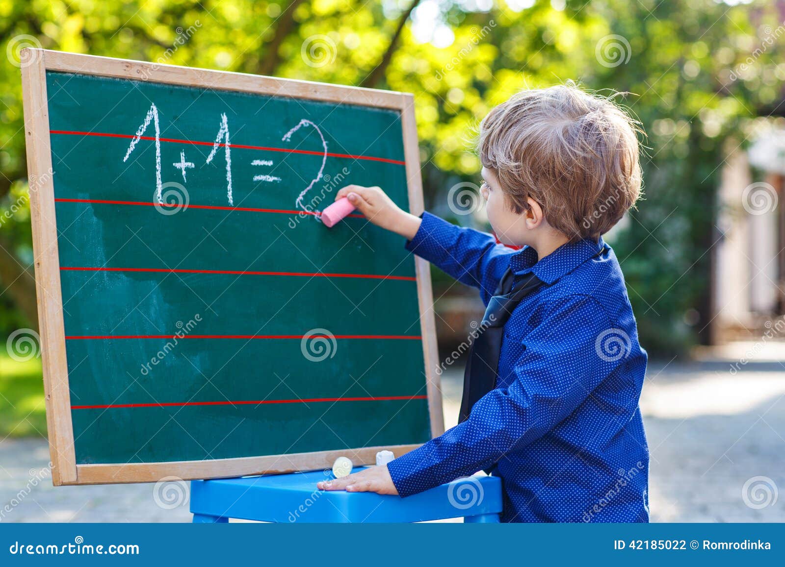 Little Boy at Blackboard Practicing Mathematics Stock Photo - Image of ...