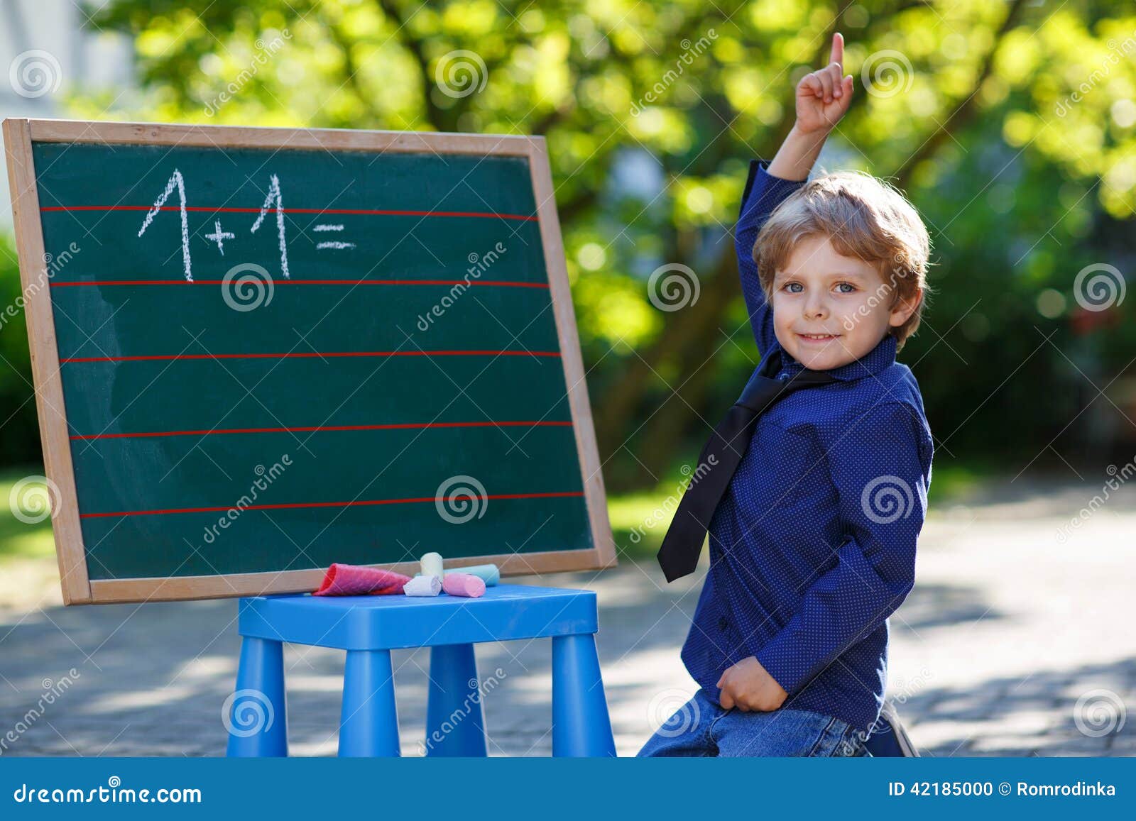 Little Boy at Blackboard Practicing Mathematics Stock Photo - Image of ...
