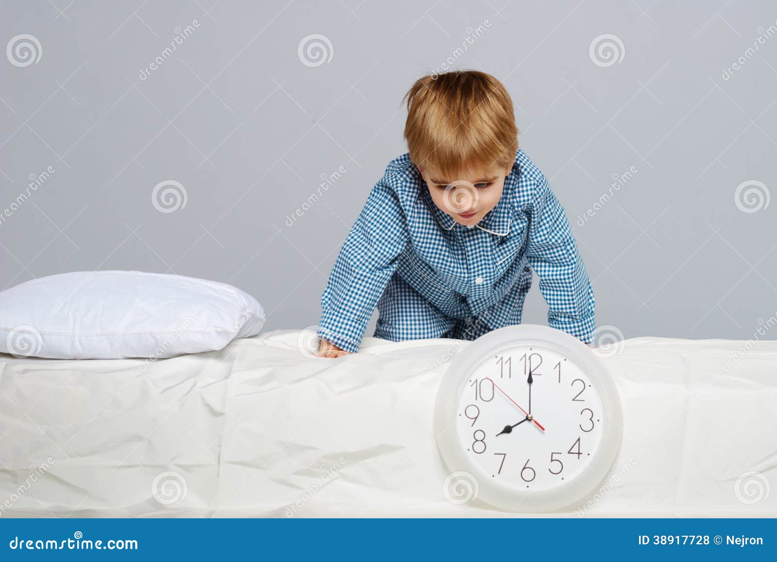 Little boy in blue pyjamas stock photo. Image of pillow - 38917728