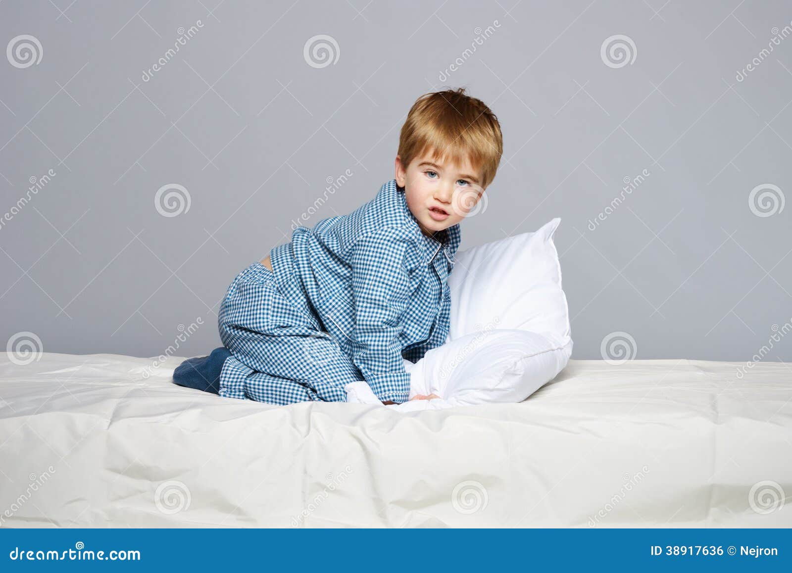 Little boy in blue pyjamas stock photo. Image of play - 38917636