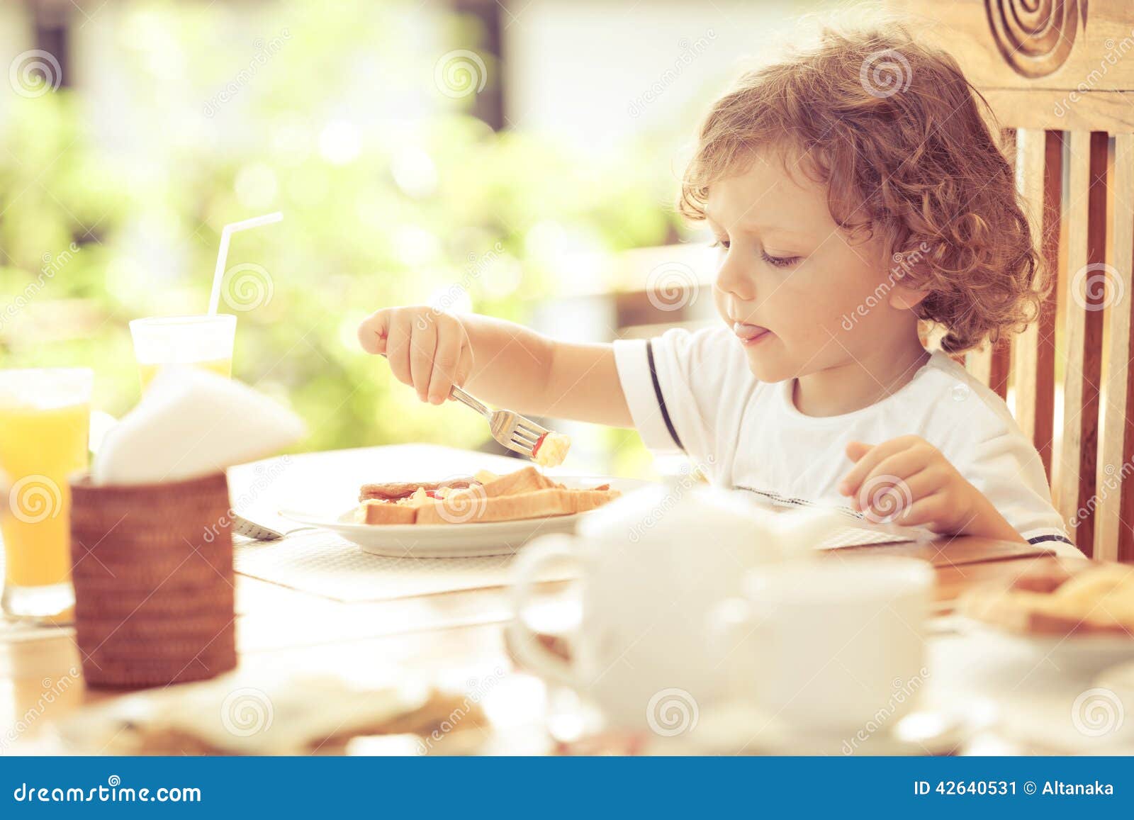Little boy at breakfast stock image. Image of drink, cute - 42640531