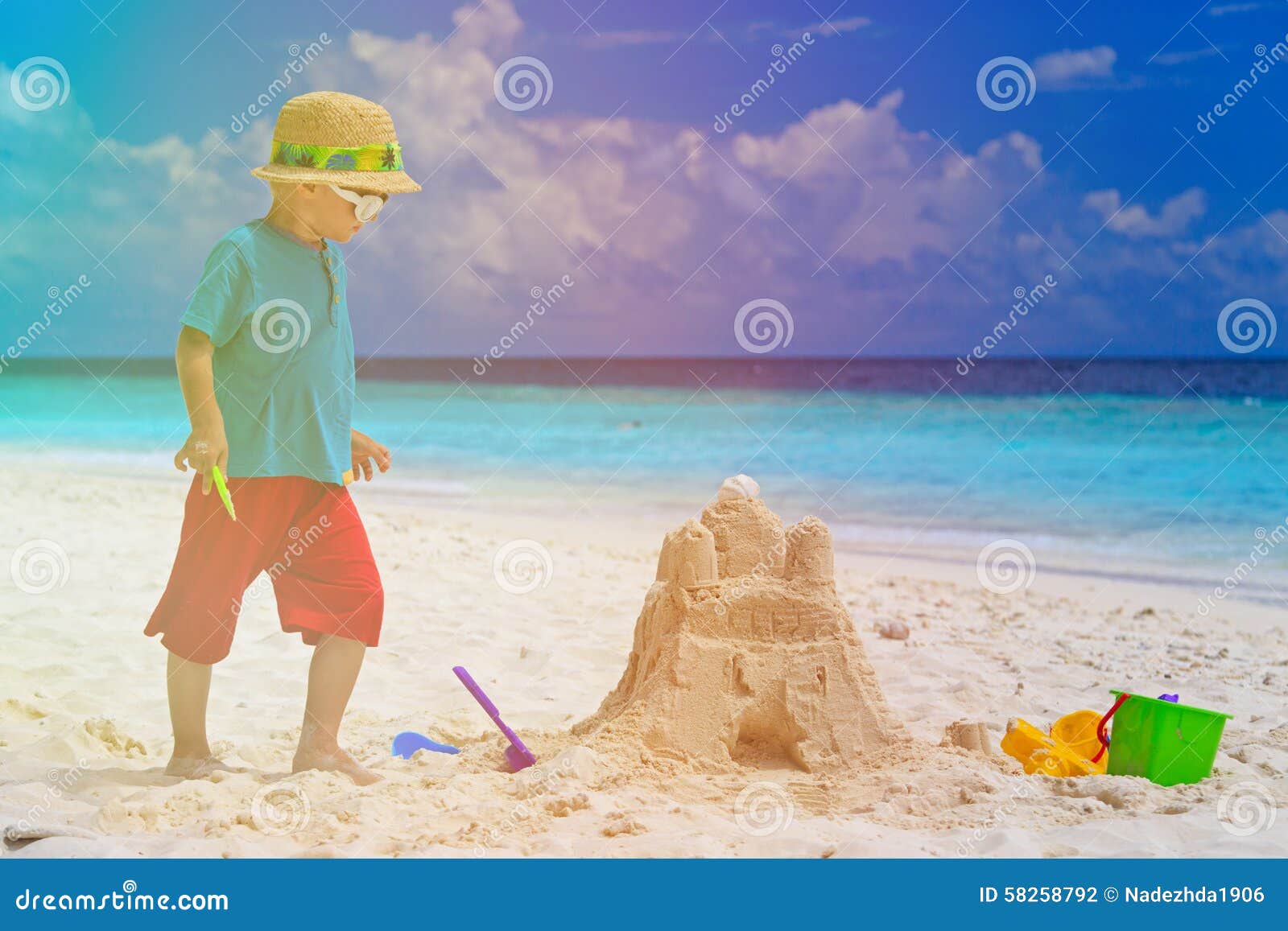Little Boy Building Sand Castle on Beach Stock Photo - Image of ocean ...