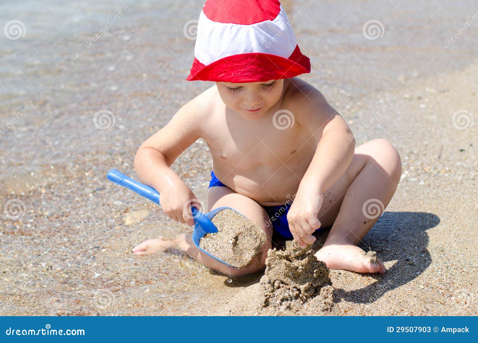 Little Boy Building Sand Castles Stock Image - Image of contented ...