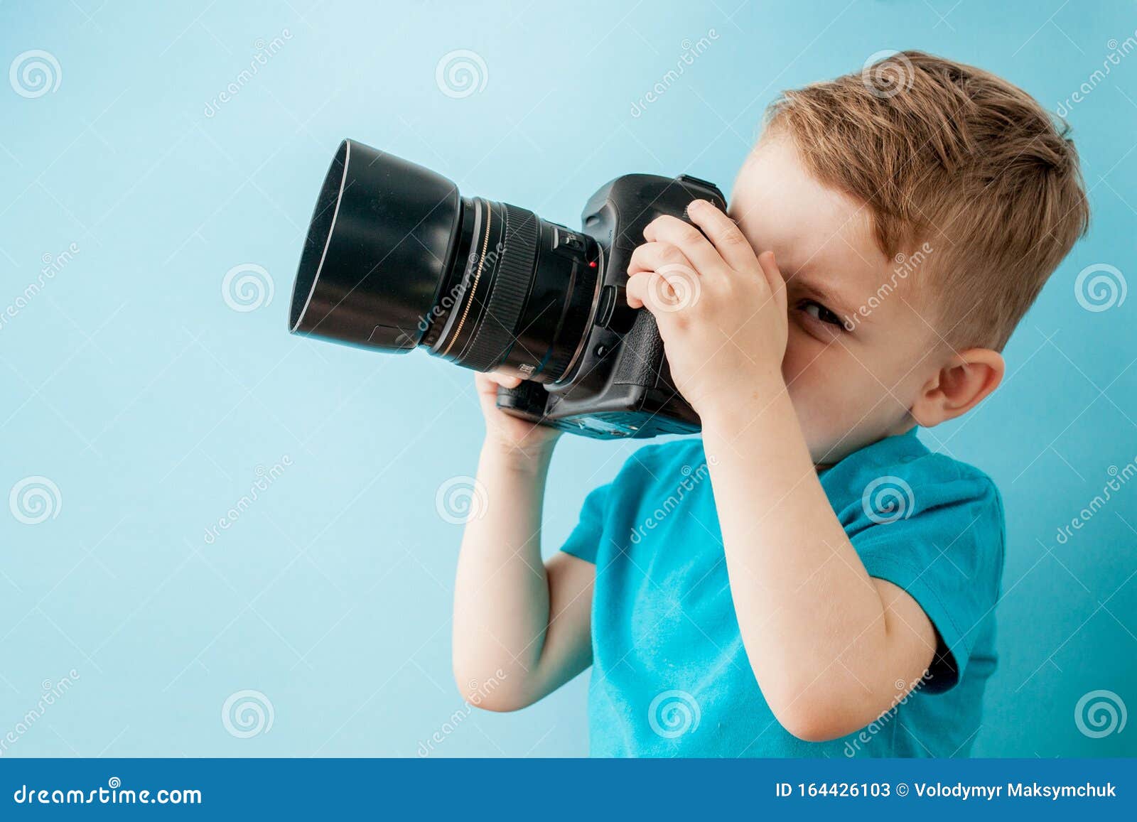 Little Boy with Camera on a Blue Background Stock Image - Image of ...