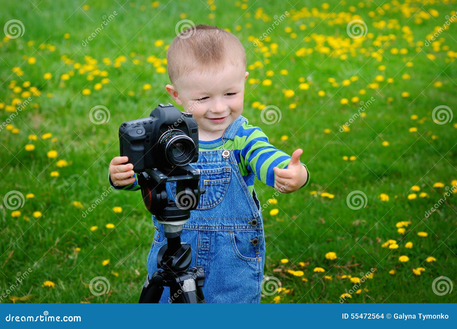 Little Boy on the Camera Shoots Stock Photo - Image of adult, nature ...