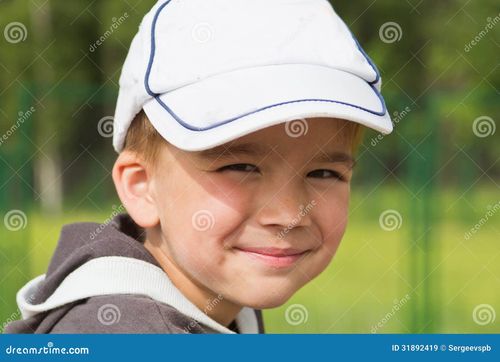 Little boy in a cap stock image. Image of laugh, cute - 31892419