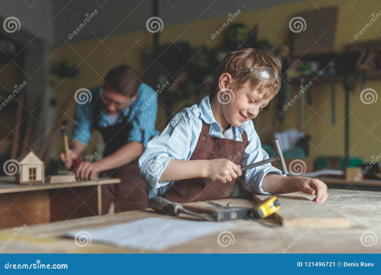 Little Boy in the Carpentry Stock Image - Image of father, professional ...