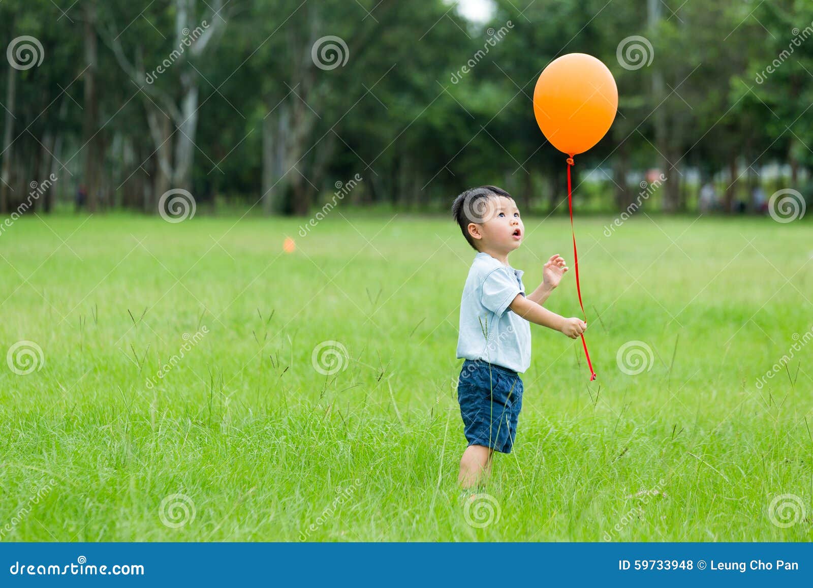 Little boy catch balloon stock photo. Image of adorable - 59733948