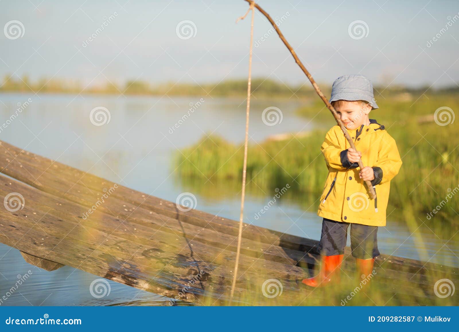 Little Boy Catching a Fish from Wooden Dock Stock Image - Image of ...