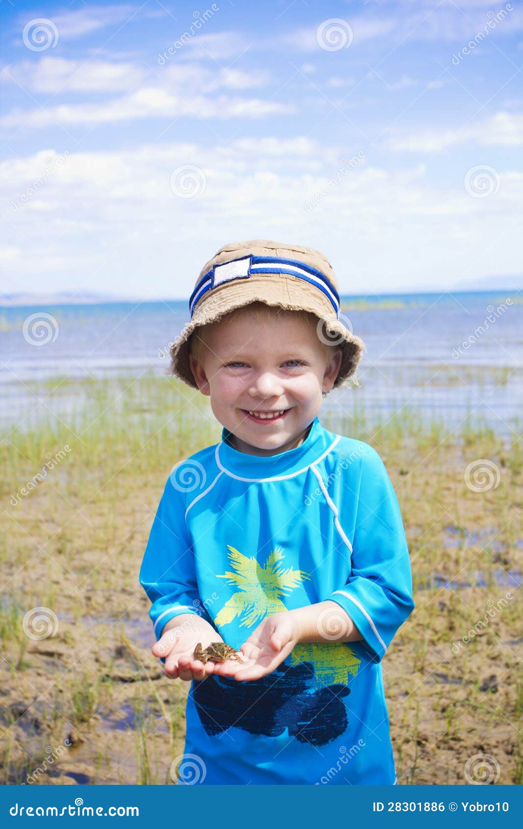 Little Boy Catching Frogs at the Lake Stock Photo - Image of showing ...