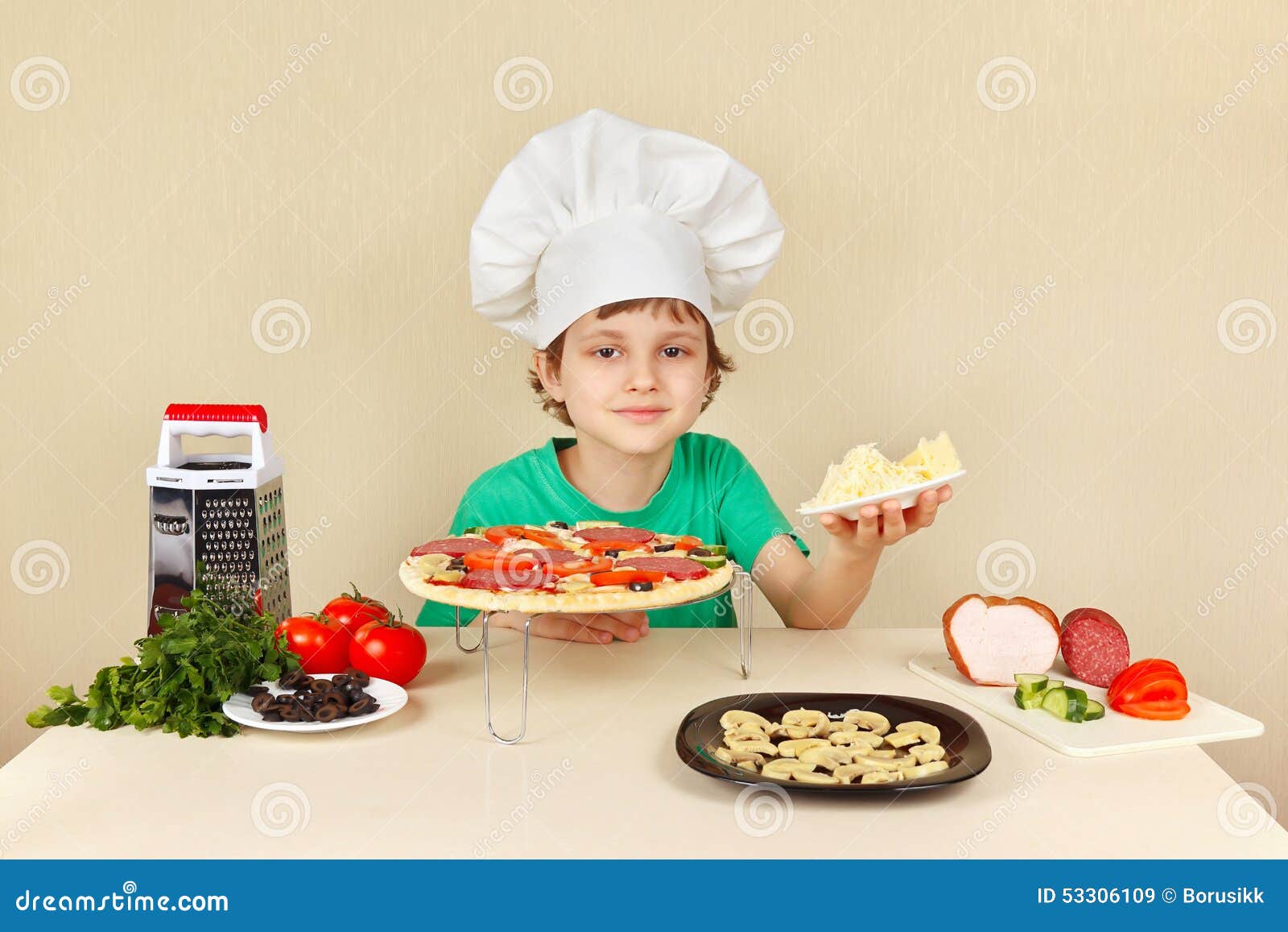 Little Boy in Chefs Hat with Grated Cheese for Pizza Stock Image ...