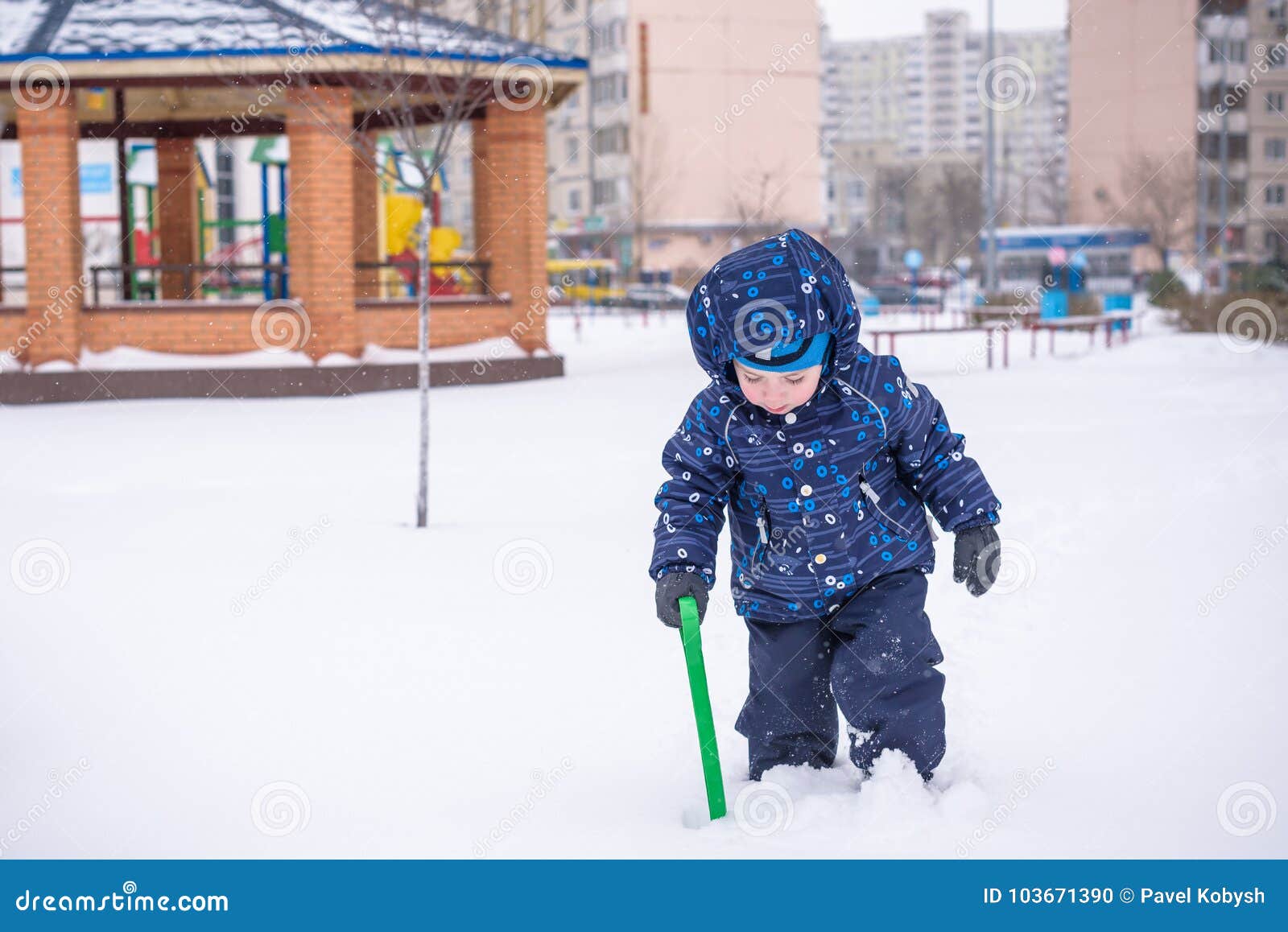 Little Boy Cleans Shovel Paths in the Yard from Snow Stock Photo ...