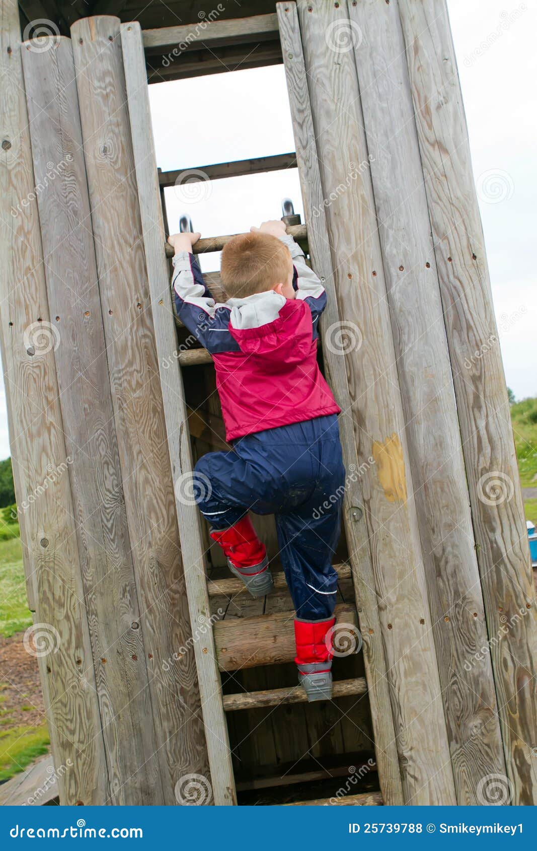 Little Boy Climbing a Ladder Stock Photo - Image of frame, wellington ...