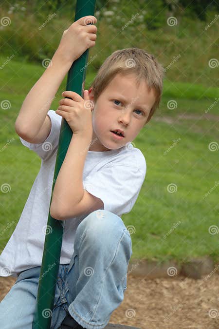 Little Boy Climbing Pole on Playground Stock Photo - Image of hold ...