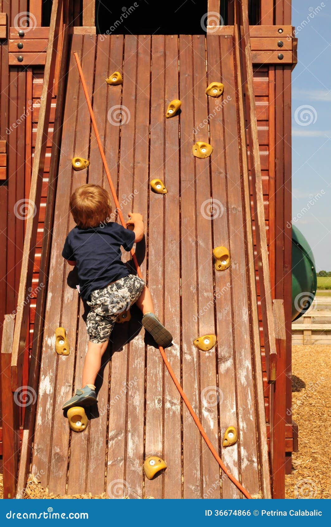 Little Boy on Climbing Wall Stock Photo - Image of reach, vertical ...